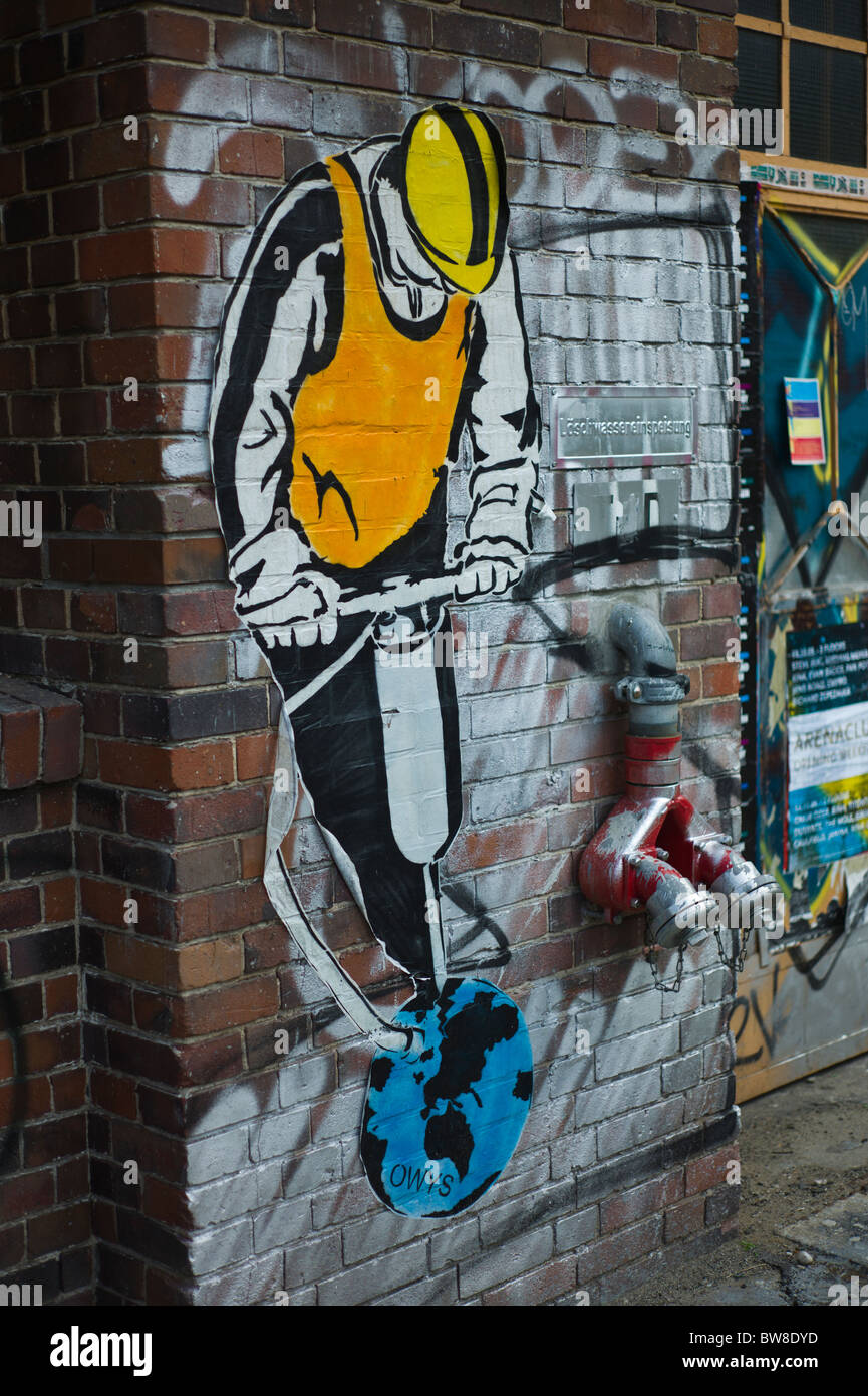 Graffiti / Poster art showing a worker holding a compressed air hammer ...