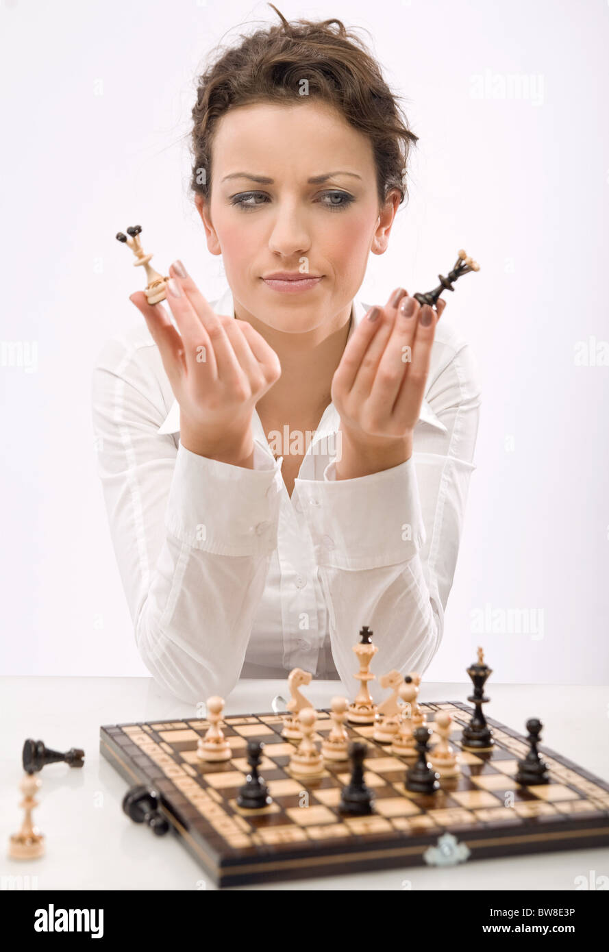 Young businesswoman playing chess Stock Photo - Alamy