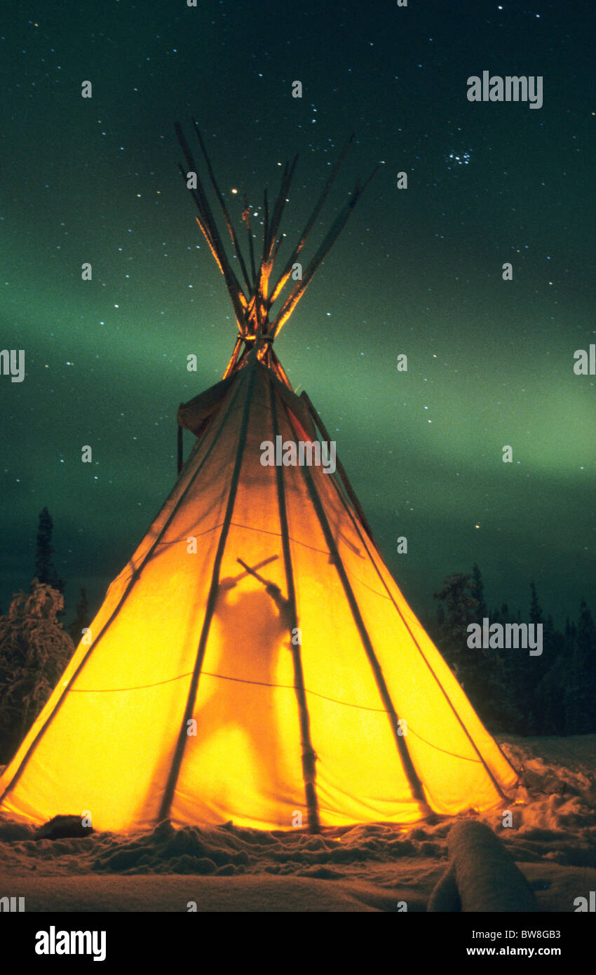 Teepee in snow beneath aurora borealis, Blachford Lake, Northwest ...
