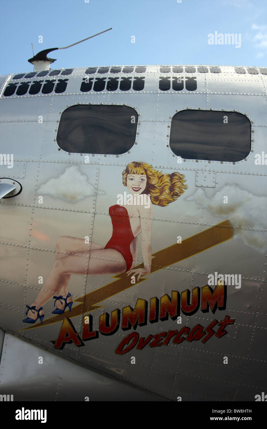 A restored World War II WWII era B-17 bomber airplane The Aluminum Overcast painted nose art ...