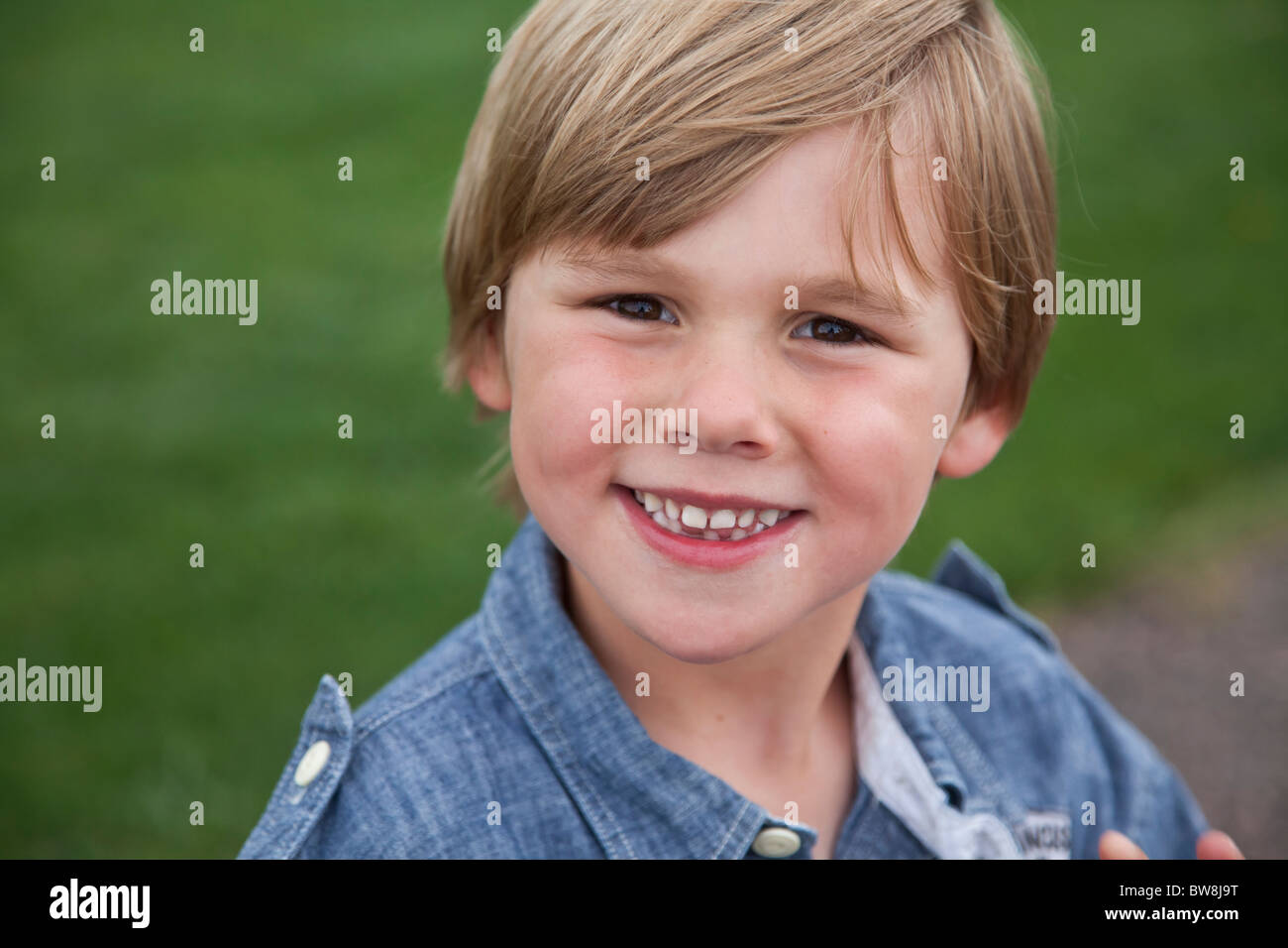 A young boy playing in the park Stock Photo - Alamy
