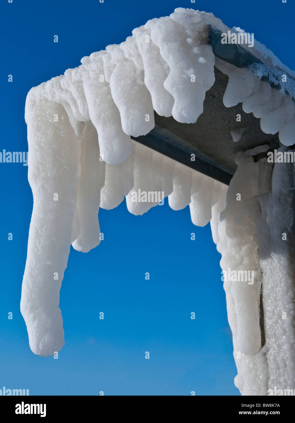 Freezing winter snow making shapes over a metal object Stock Photo - Alamy
