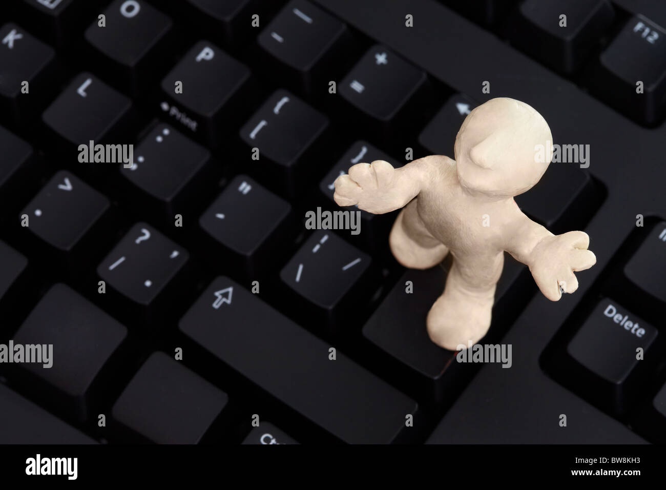 Photo of plasticine white man over keyboard Stock Photo - Alamy