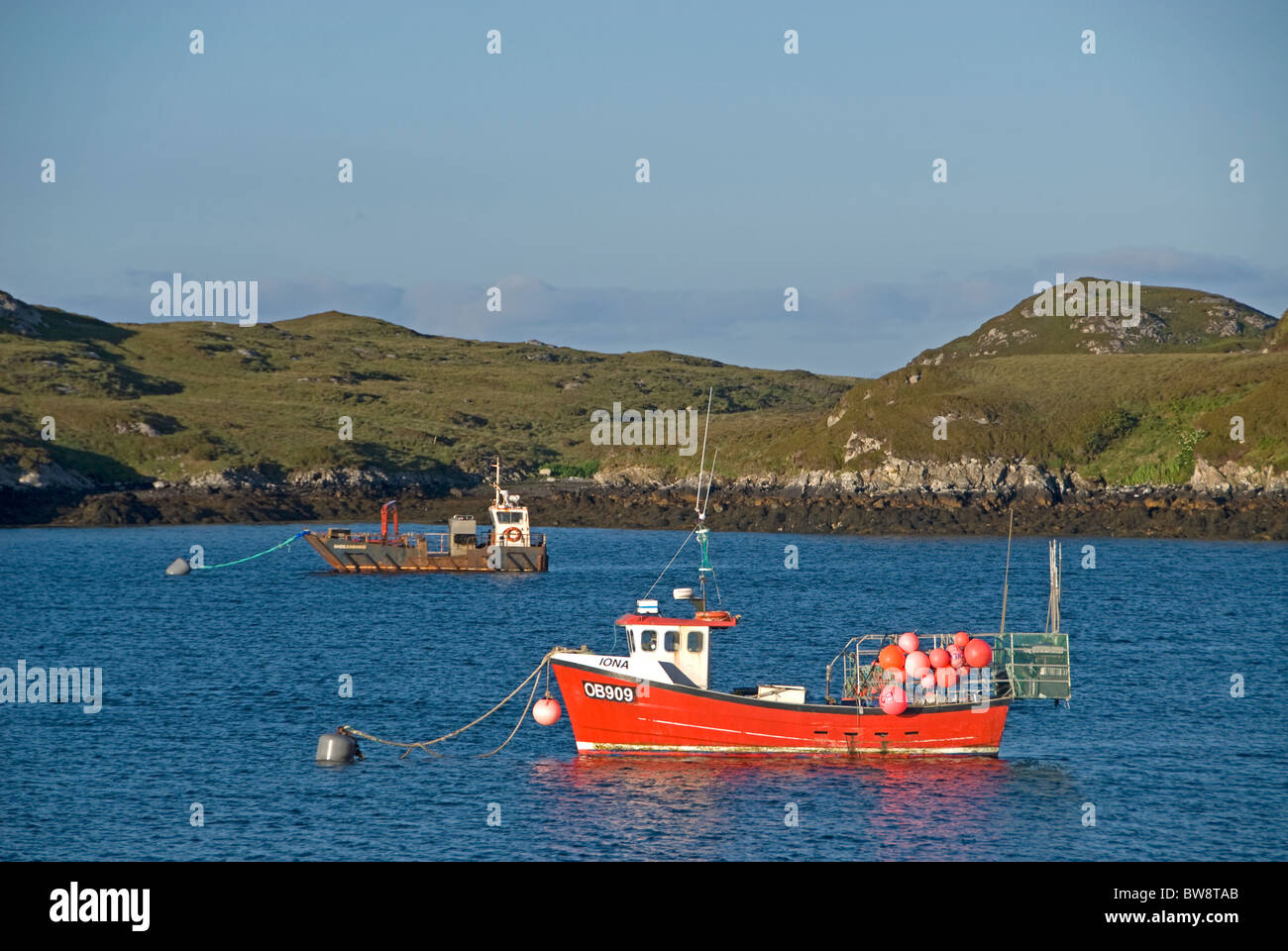 Fishing Boats moored in sheltered Loch Carnan, South Uist, Scotland ...