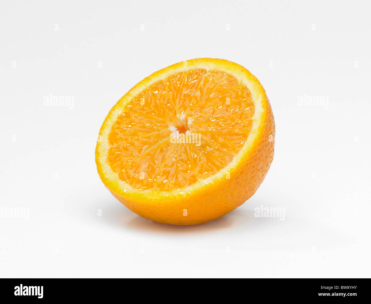 A single sliced orange on white background Stock Photo - Alamy