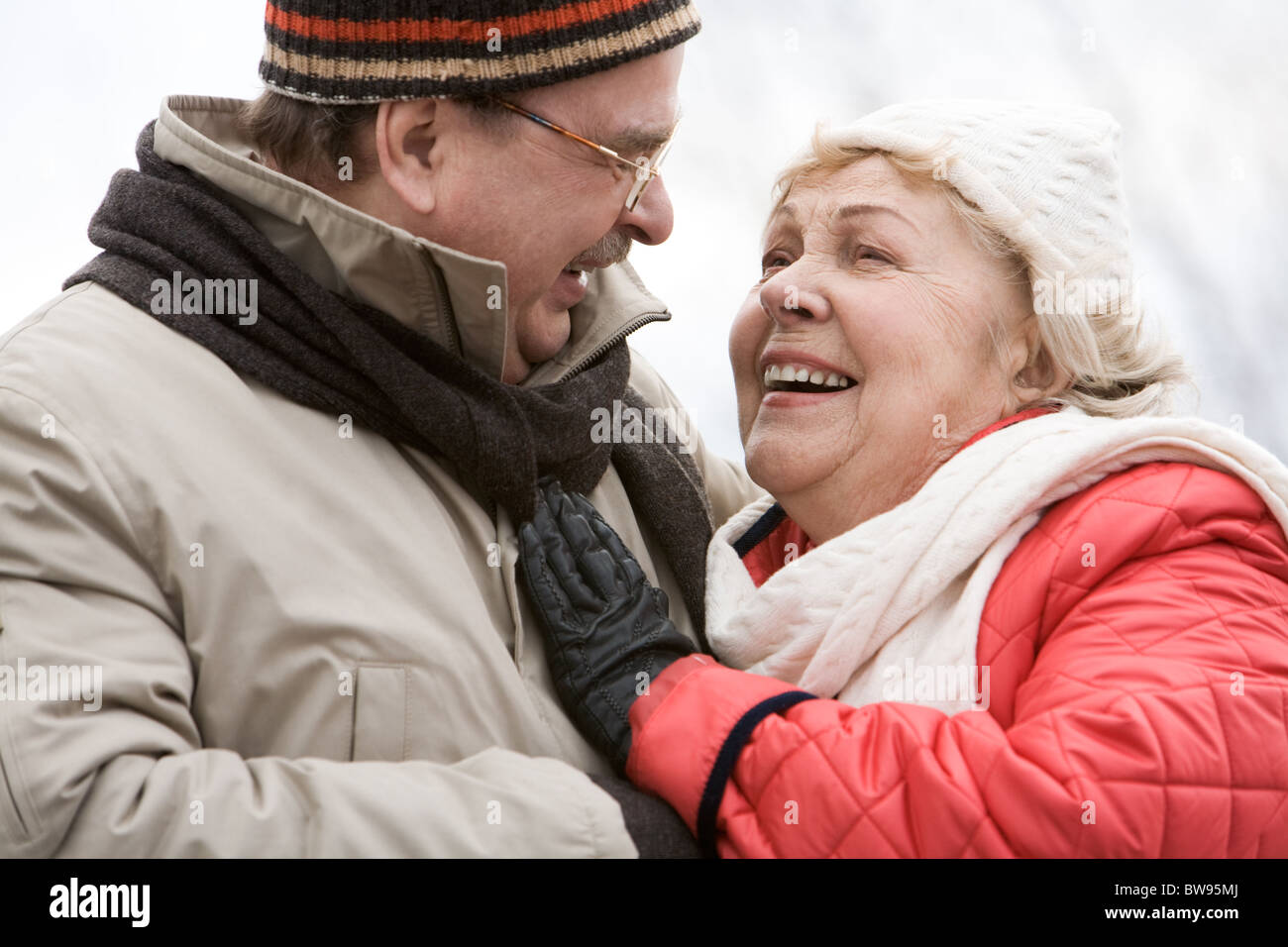 Portrait of happy companions looking at each other with smiles Stock ...