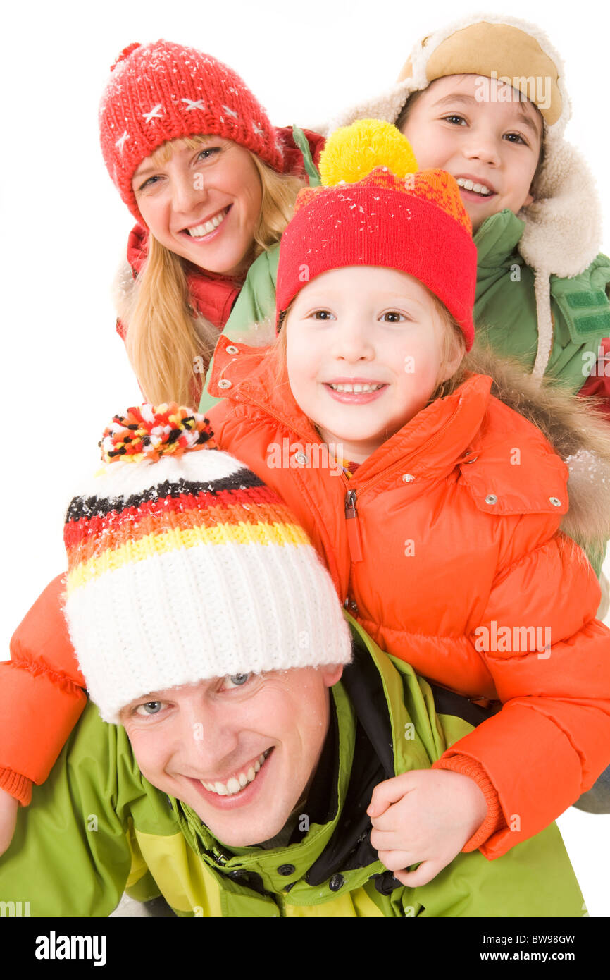 Heap of happy family members in winter clothing having fun Stock Photo ...