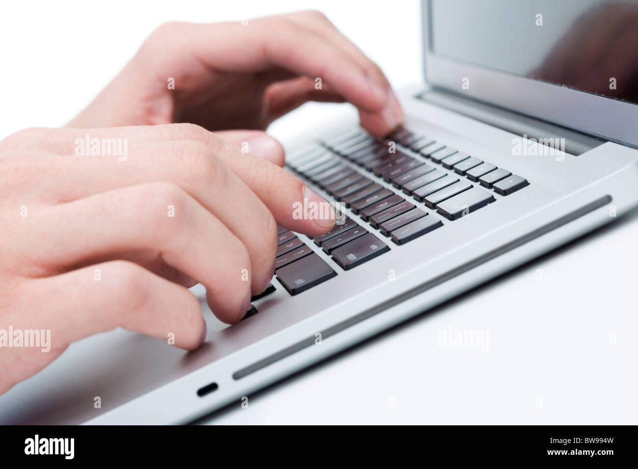 Close-up of male hand over keyboard of laptop during computer work ...