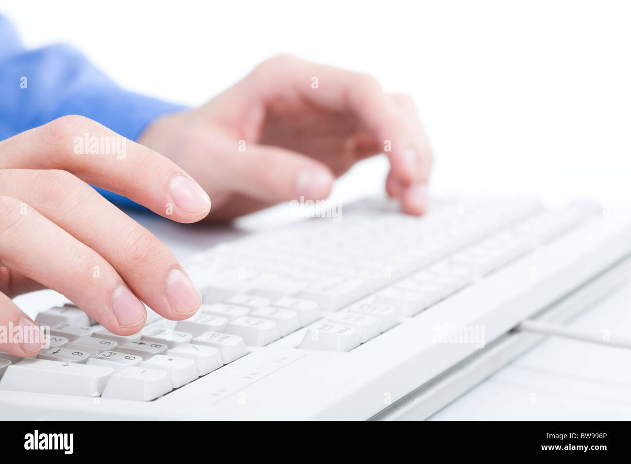 Close-up of male hand touching buttons of white computer keyboard Stock ...