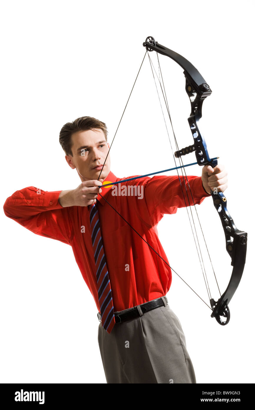 Conceptual image of serious man taking aim at something Stock Photo - Alamy