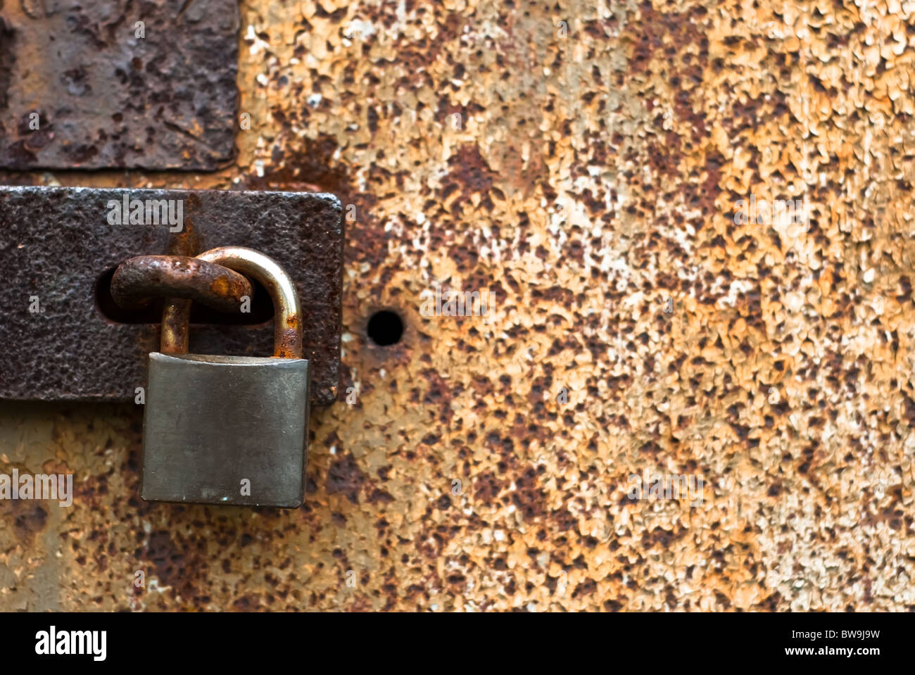 Old rusty padlock for background Stock Photo - Alamy