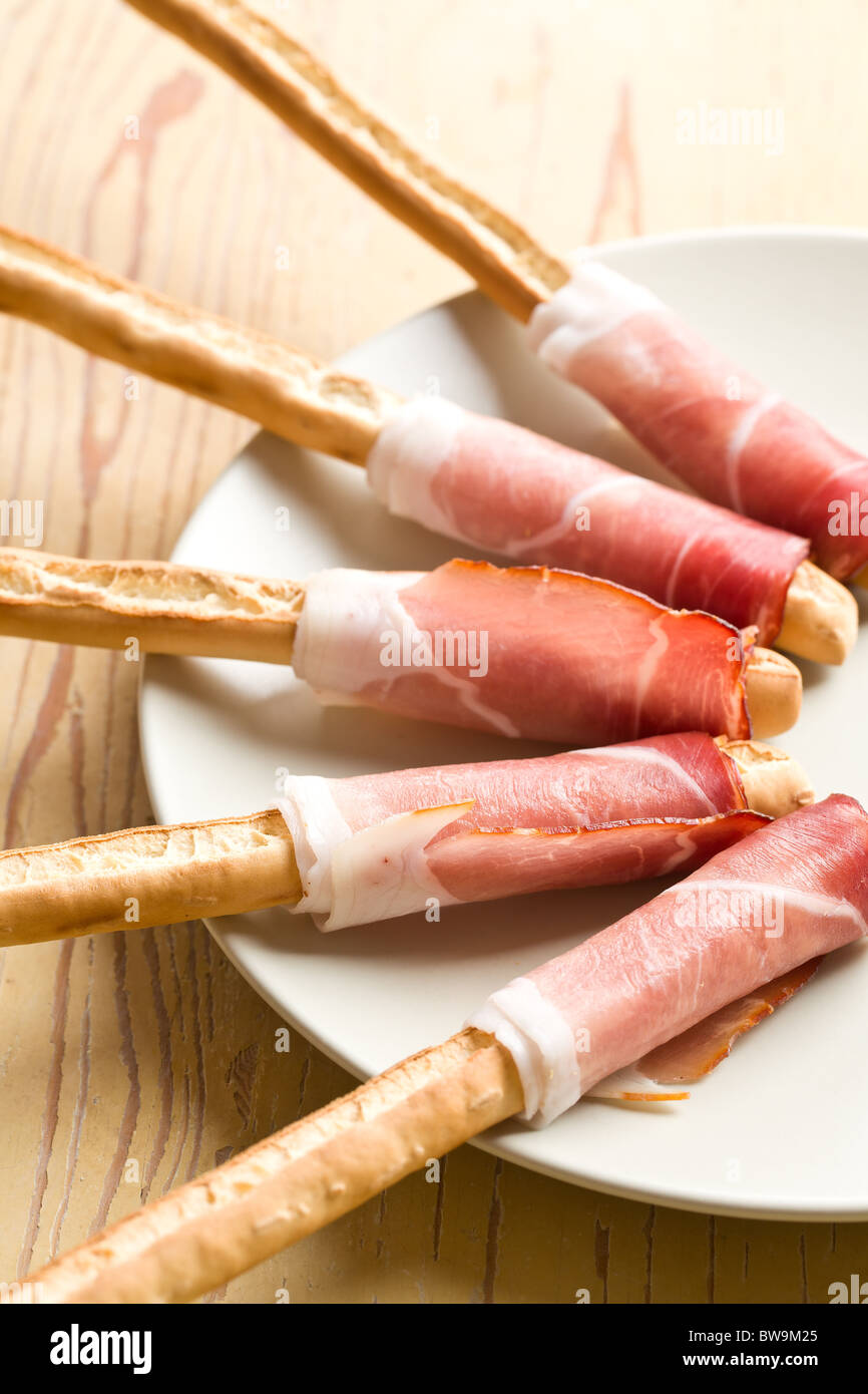 grissini sticks with ham Stock Photo - Alamy