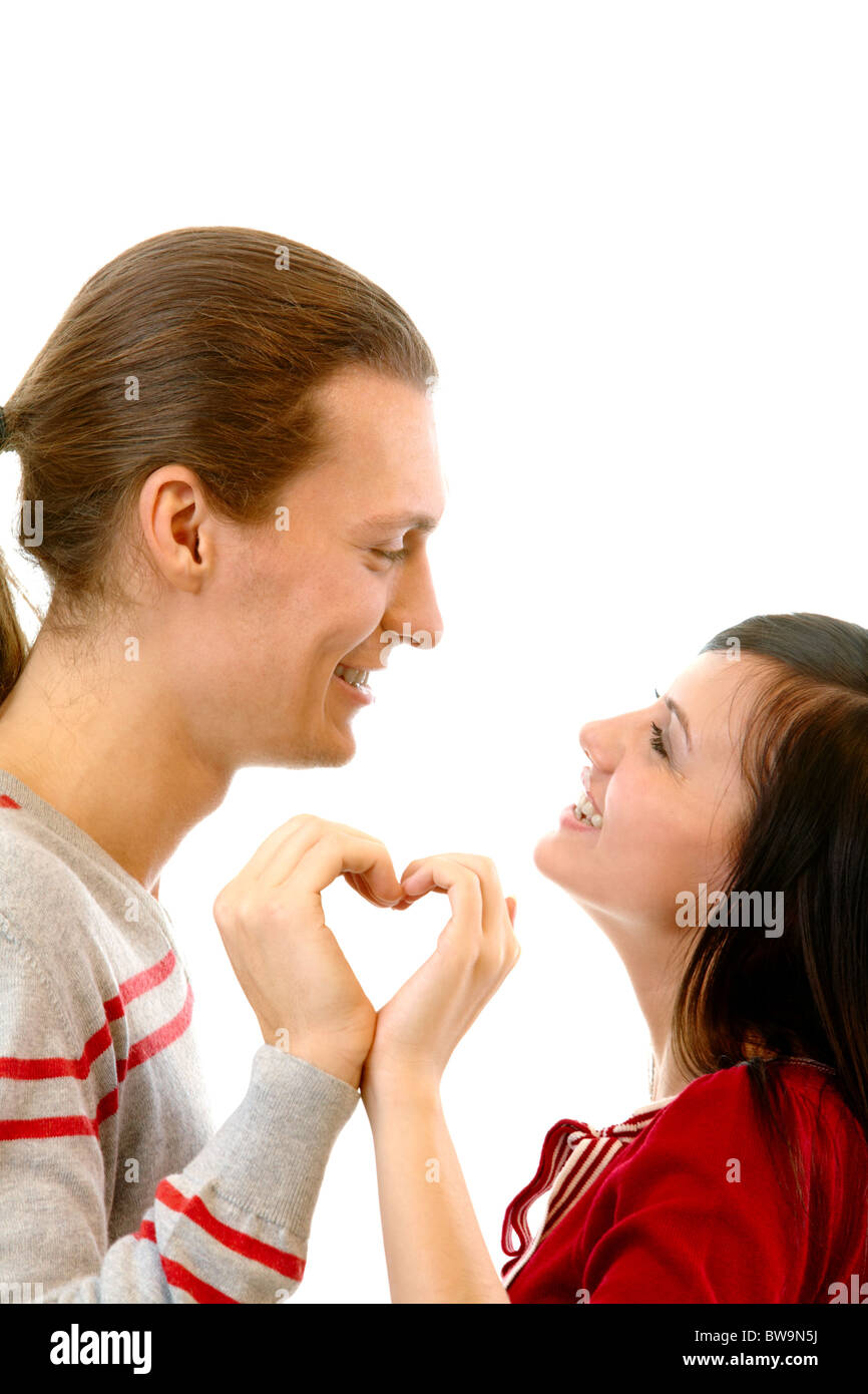 Portrait of attractive girl and her boyfriend looking at each other ...