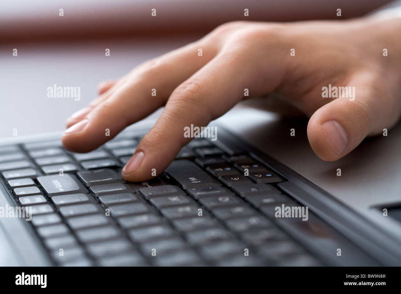 Close-up of male hand over black keyboard of laptop during typing Stock ...