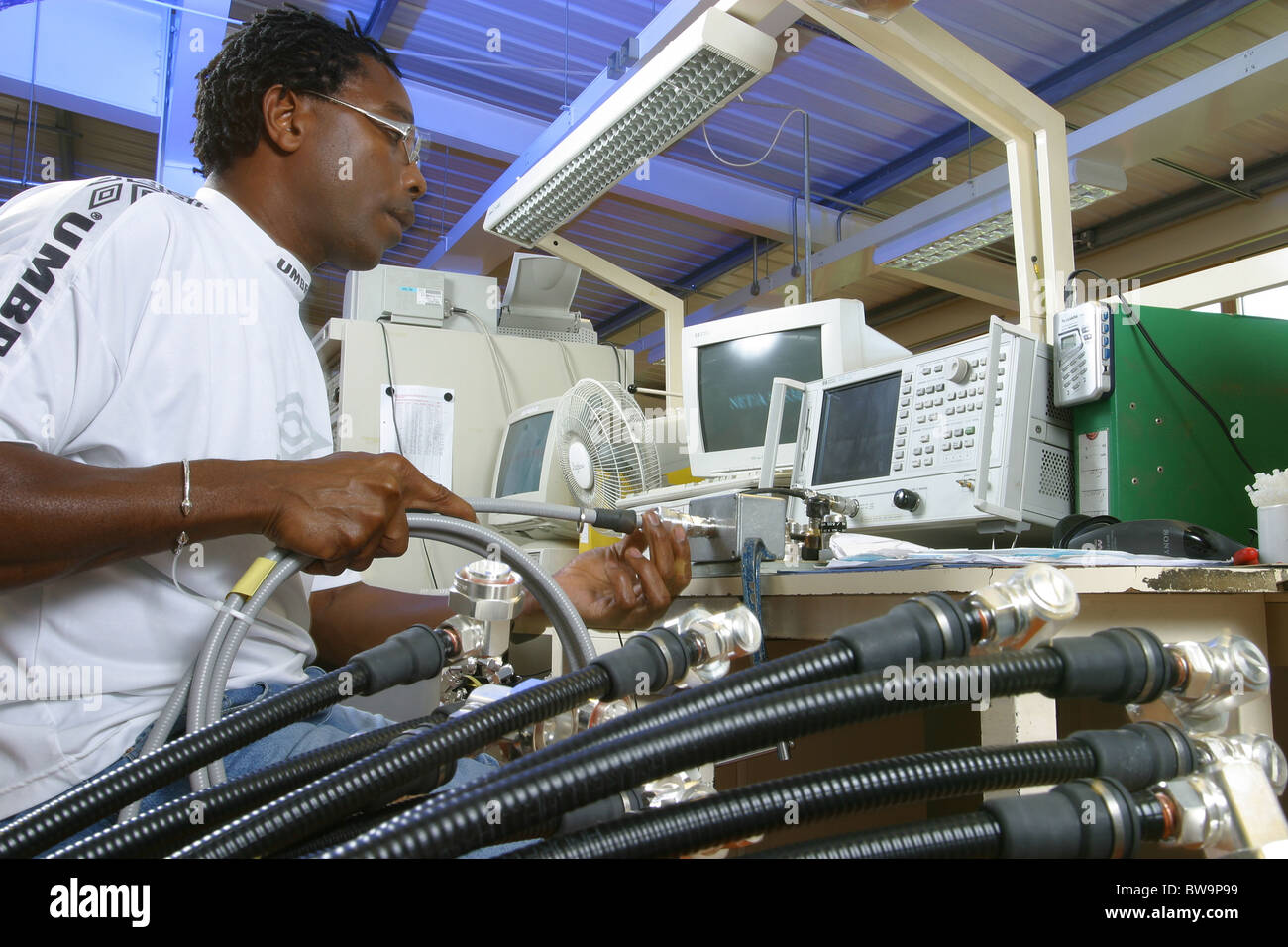 quality controller testing electrical components Stock Photo - Alamy