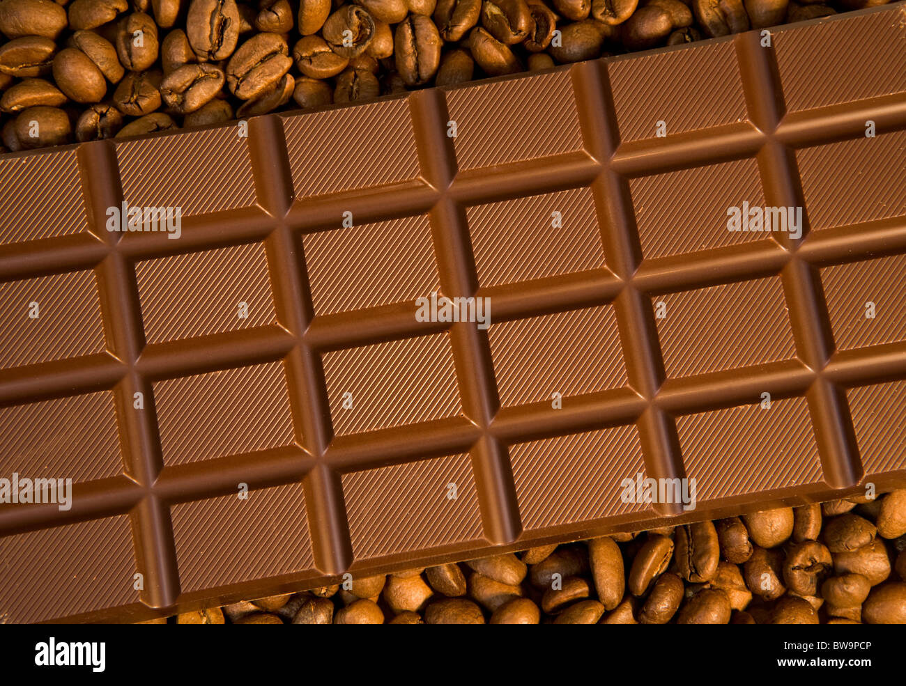 Close-up of fresh milk chocolate with coffee grains underneath Stock ...