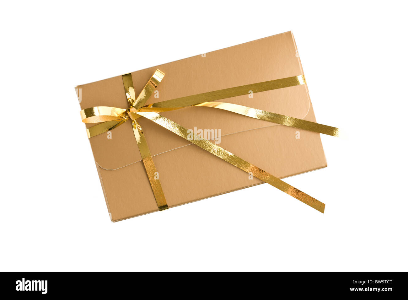 gold wrapped gift on white background Stock Photo - Alamy