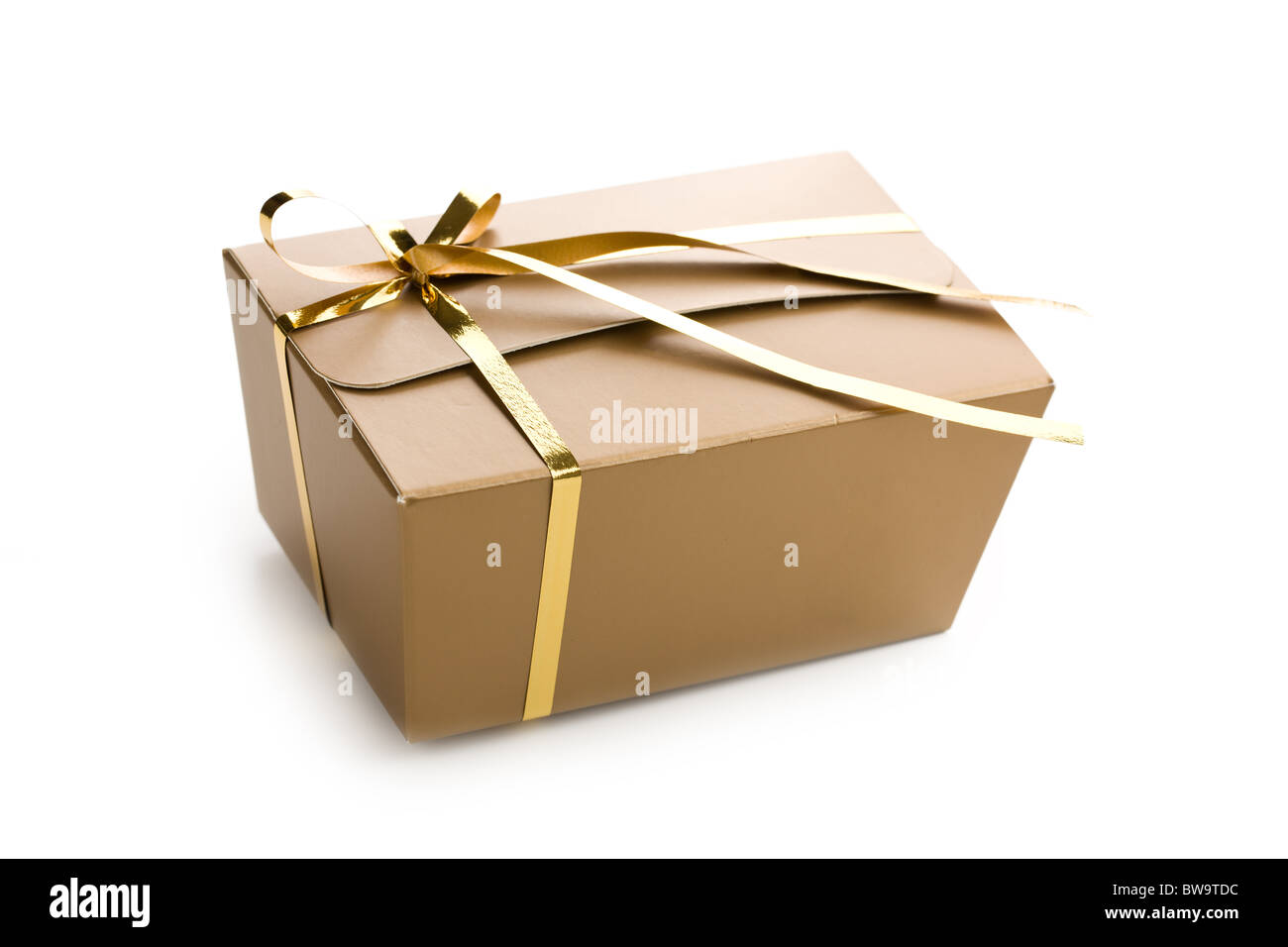 gold wrapped gift on white background Stock Photo - Alamy
