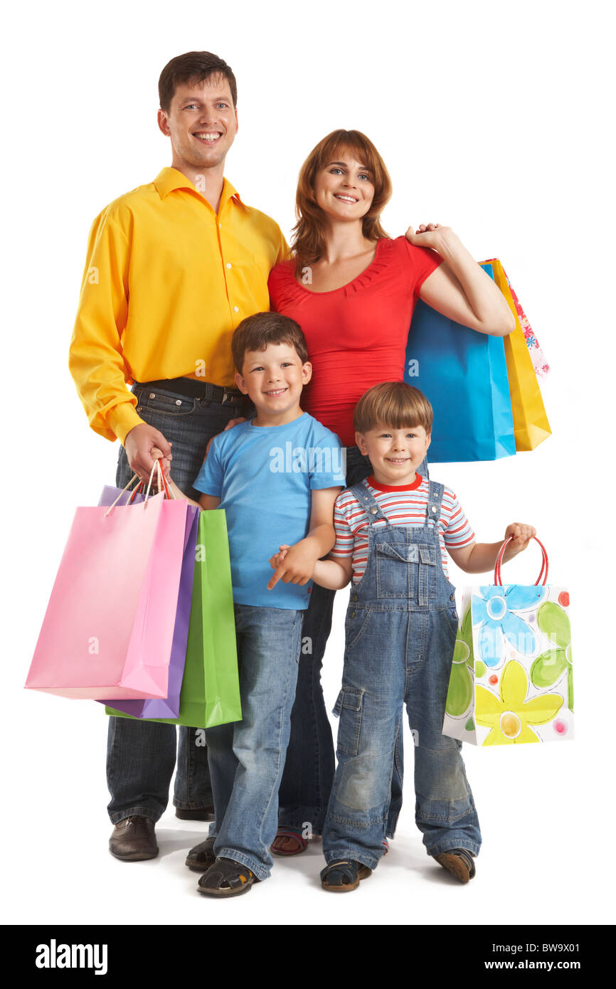 Photo of friendly parents and siblings with bags isolated over white ...