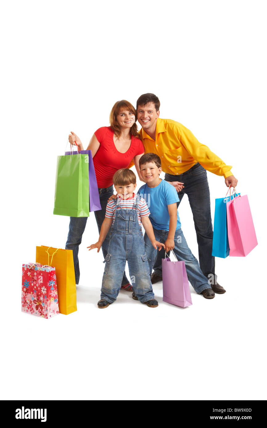 Image of cheerful family members standing next to each other with happy ...