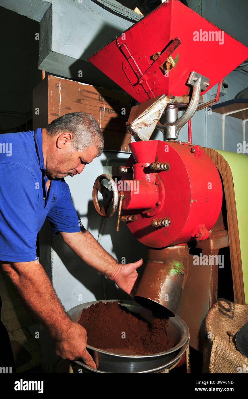 Israel, Nazareth, small coffee roasting shop worker grinds freshly ...