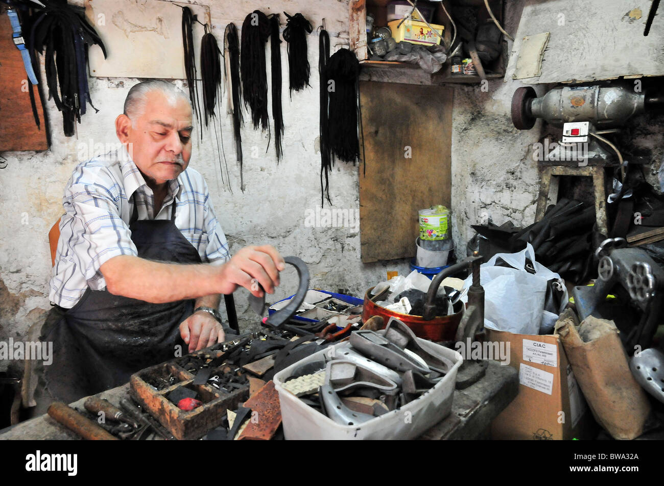 A shoemaker in his workshop Stock Photo - Alamy