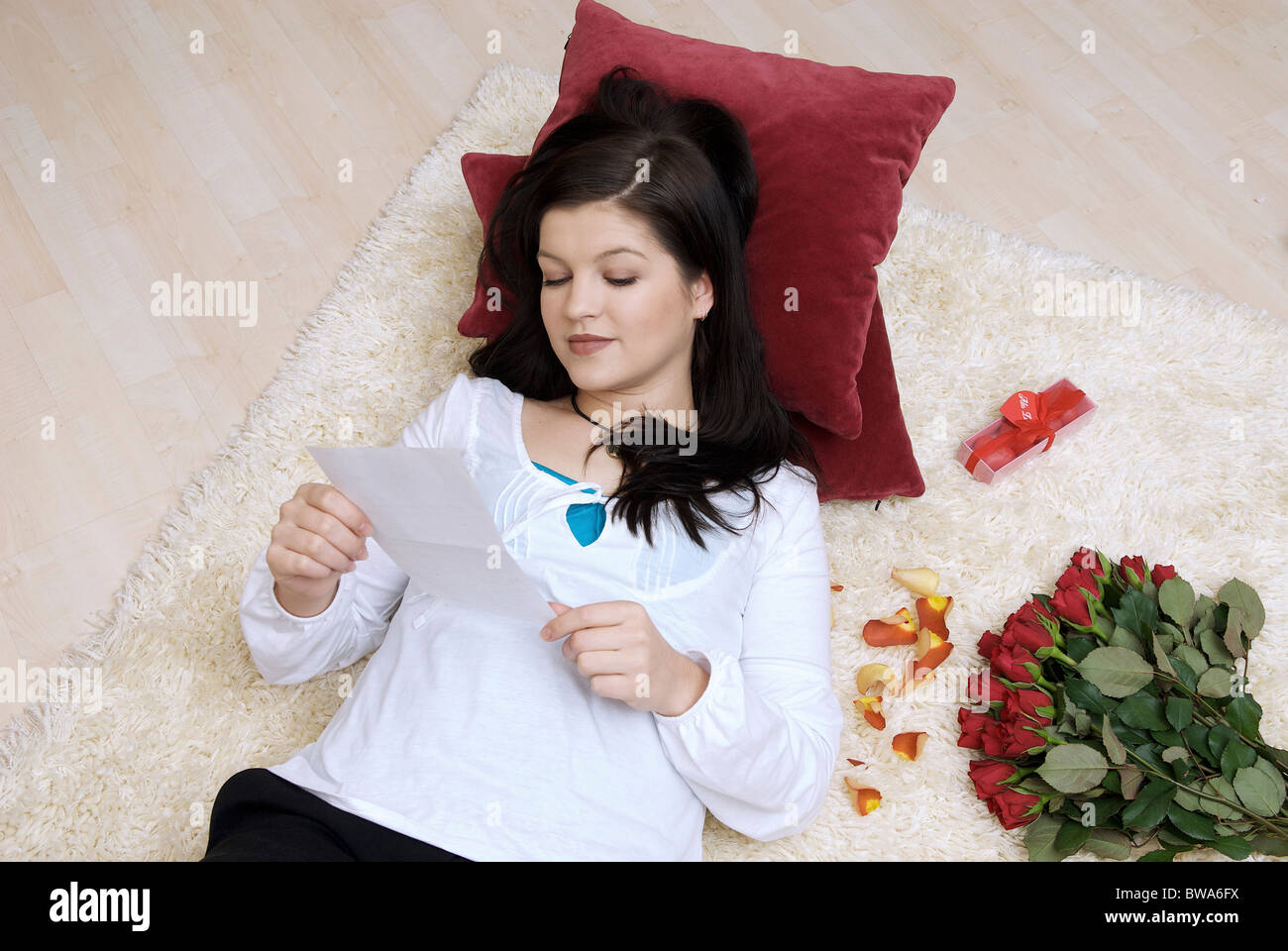 Young woman reading a love letter Stock Photo - Alamy