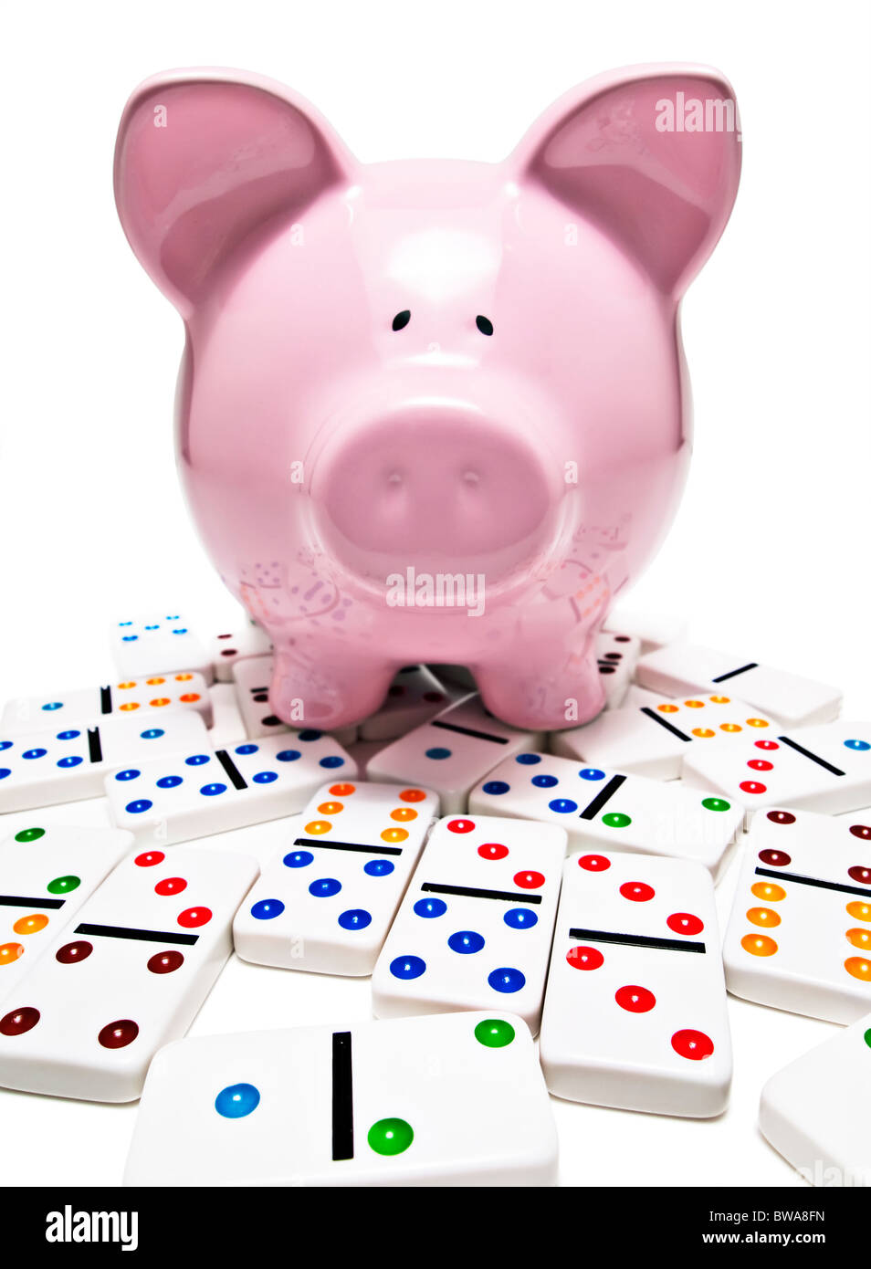 piggy bank and dominos Stock Photo - Alamy