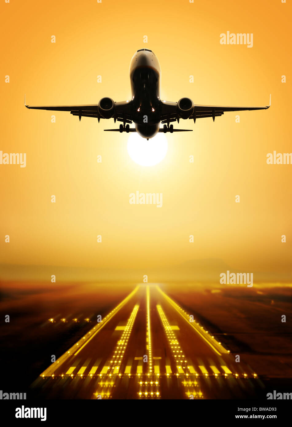 passenger plane fly up over take-off runway from airport at sunset Stock Photo - Alamy