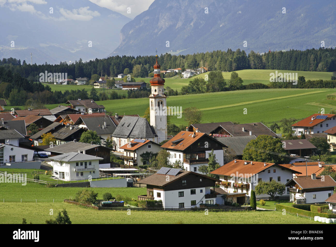 Austria Tirol Tyrol Tulfes small town church steeple mountain high road ...