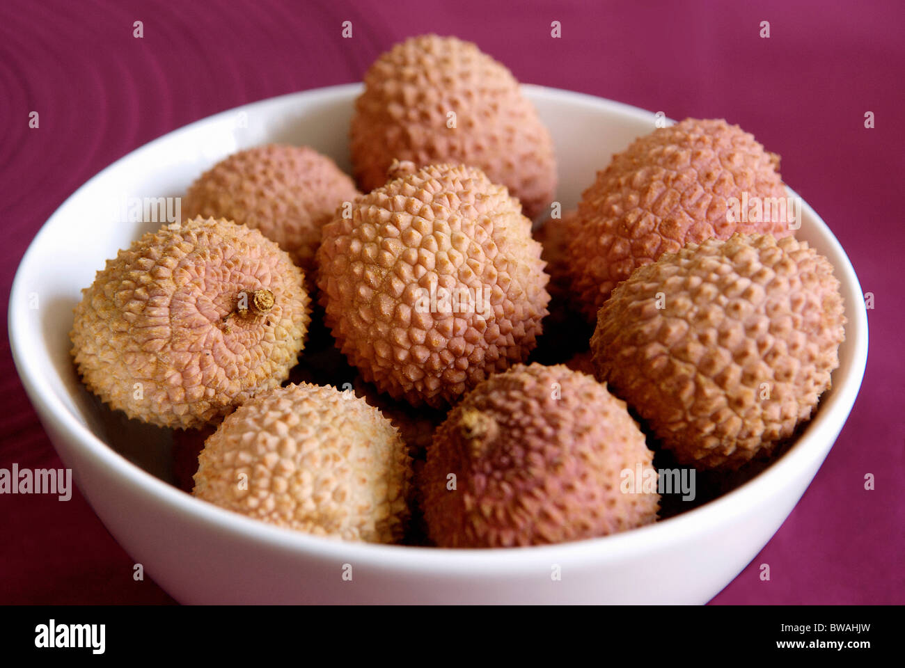 Fresh lychees in a bowl Stock Photo - Alamy