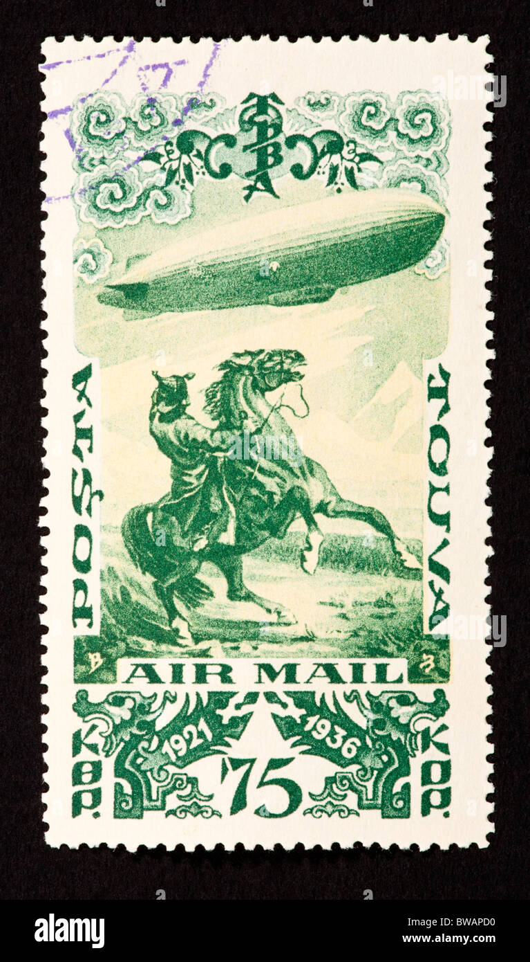 Postage stamp from Tannu Tuva depicting a zeppelin and a horseman Stock ...