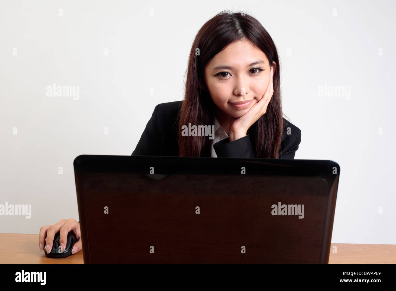 Office lady uses notebook computer Stock Photo - Alamy