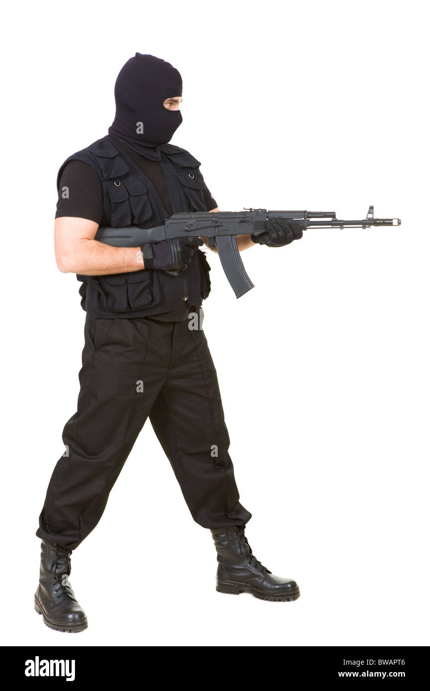 Photo of murderer with gun attacking someone while pointing it forwards ...