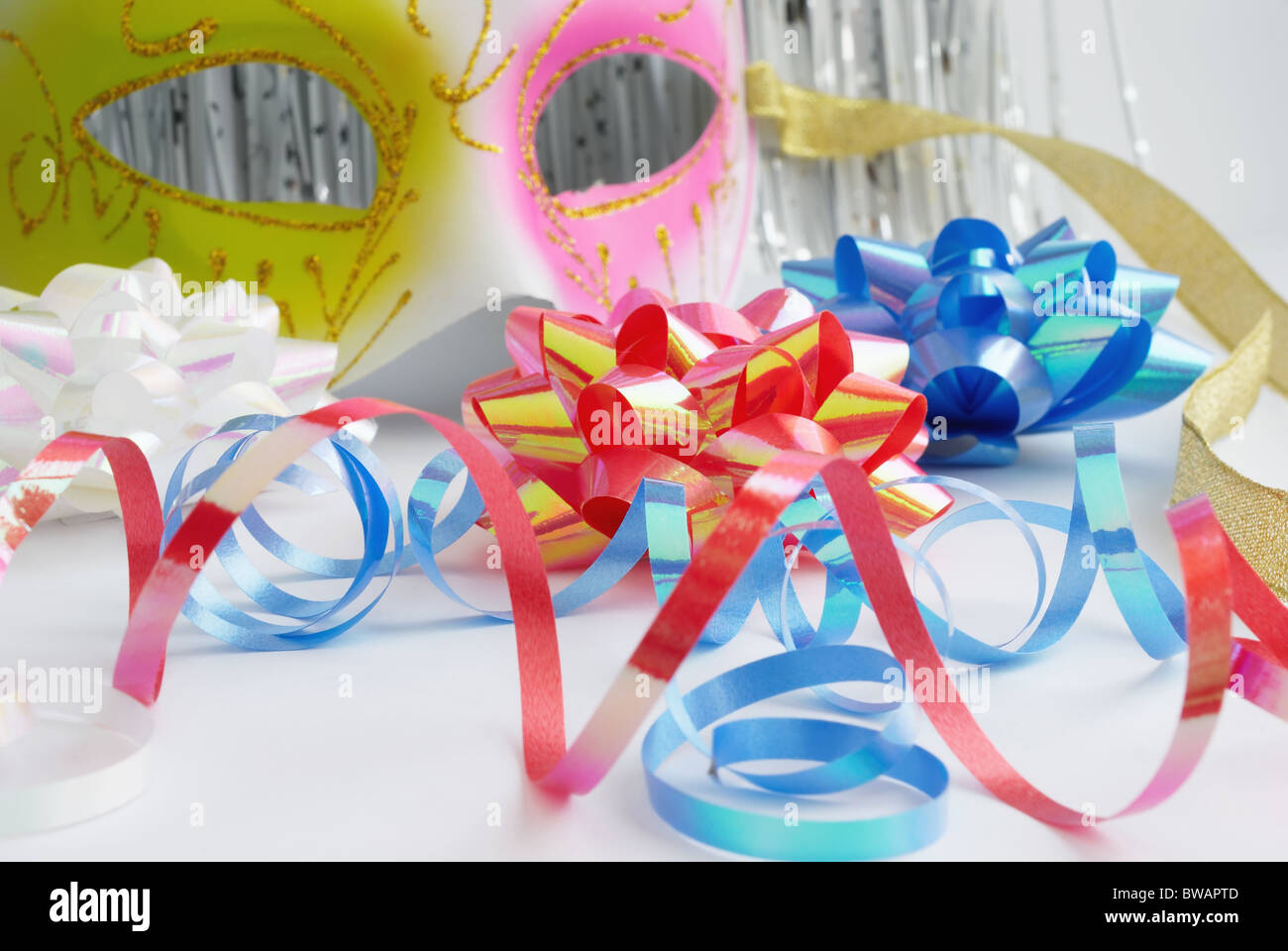 Carnival mask and decorative bows on a white backg Stock Photo - Alamy