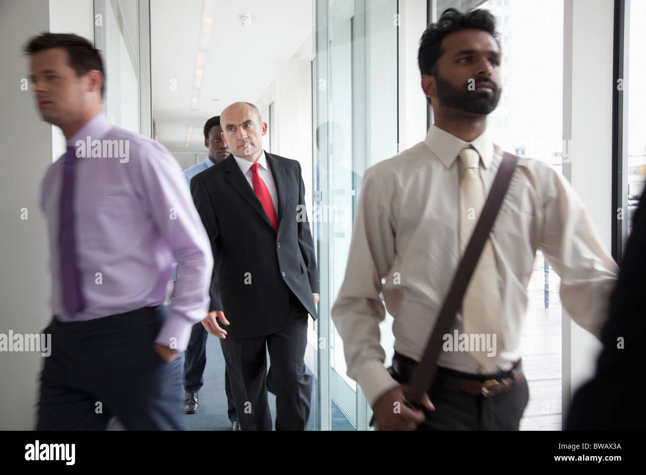 Business people walking fast past camera Stock Photo - Alamy