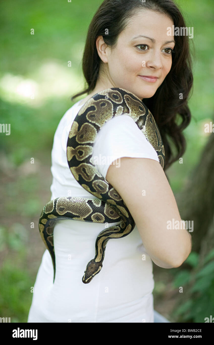 Woman with a snake Stock Photo - Alamy