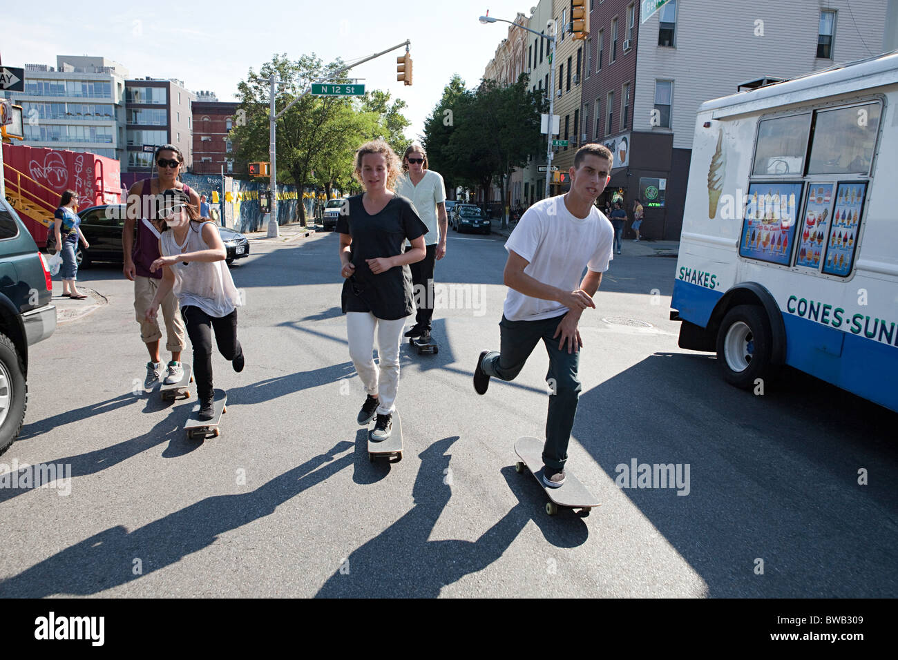 Skateboarders on urban street Stock Photo - Alamy