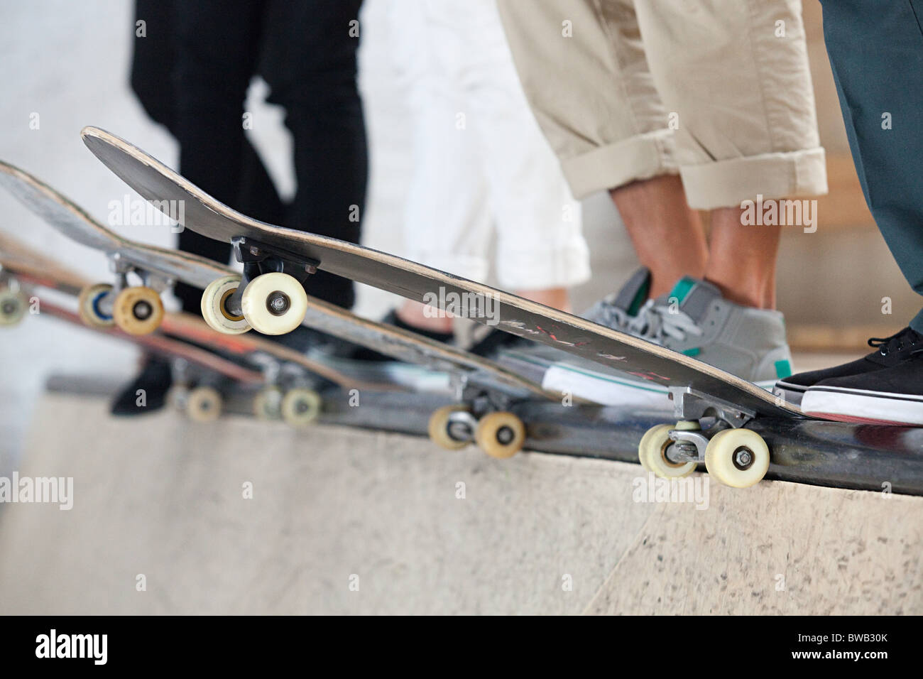Skaters and their boards Stock Photo - Alamy