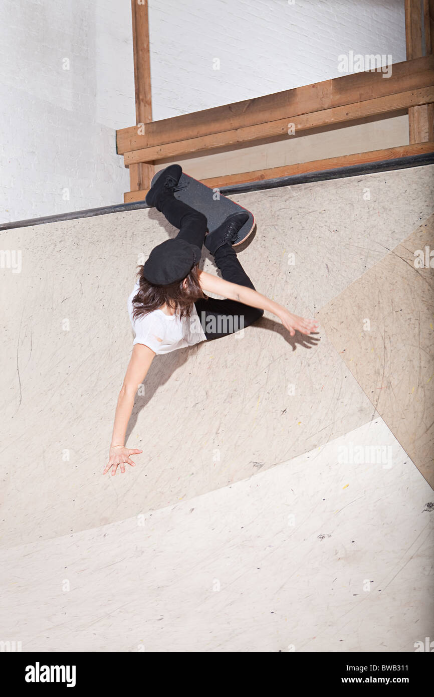 Skateboarder on ramp at skate park Stock Photo - Alamy