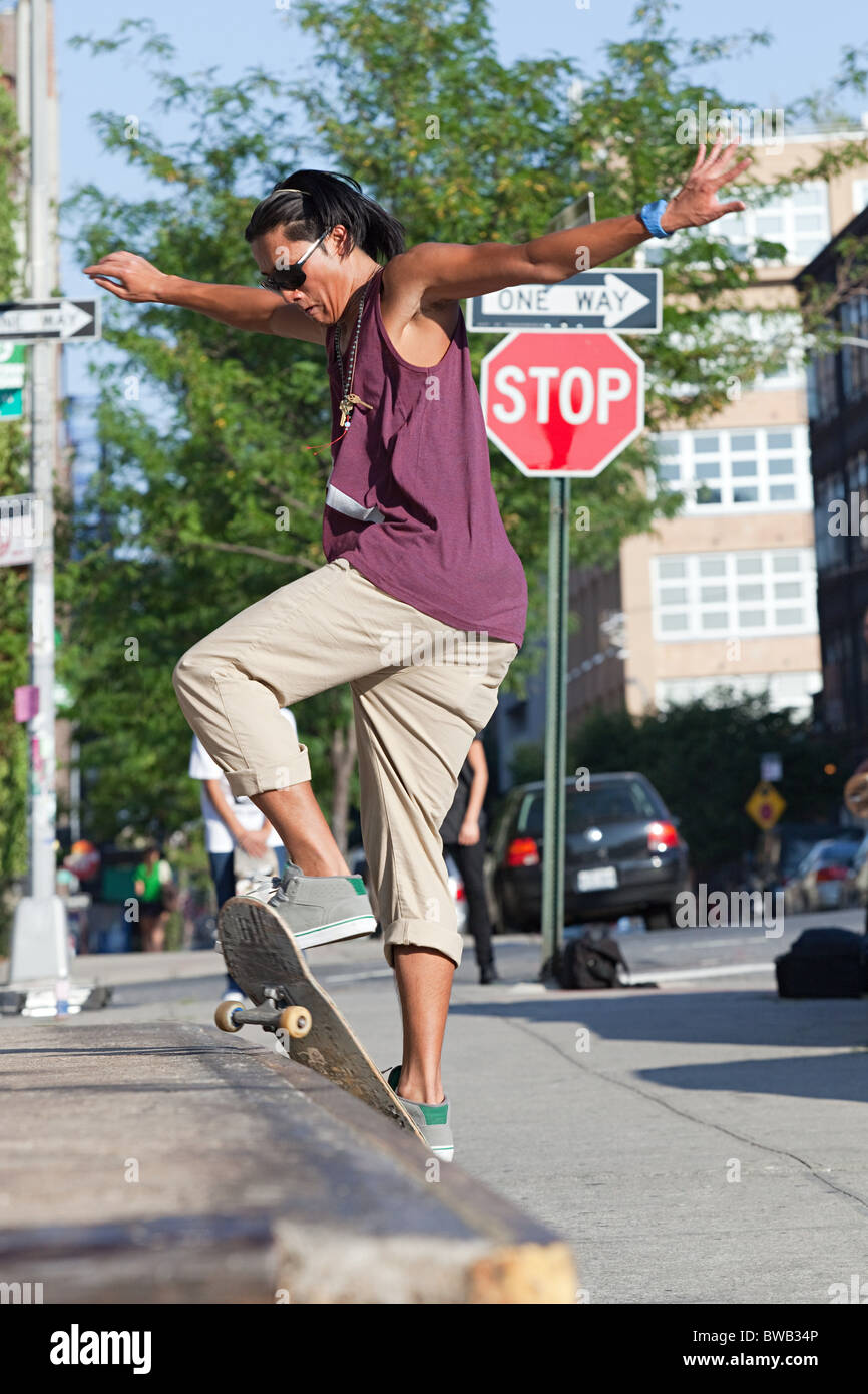 Skateboarder on urban street Stock Photo - Alamy