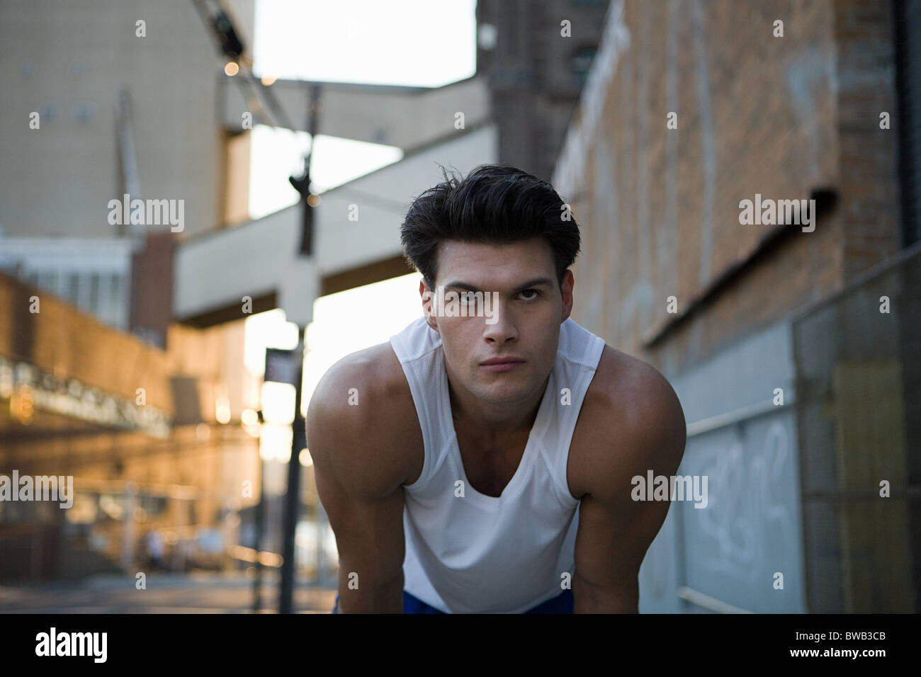Male runner in urban setting Stock Photo - Alamy