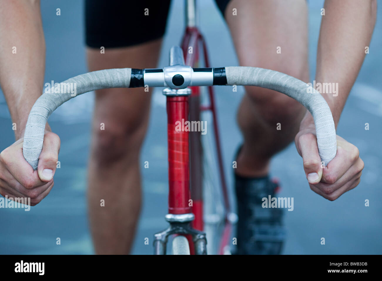 Hands on cyclist and handlebars Stock Photo - Alamy