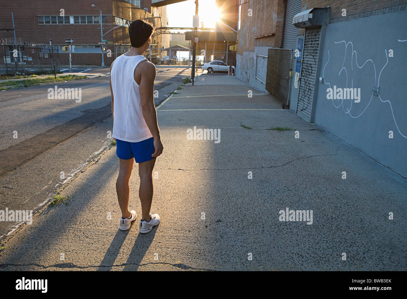Male runner on urban street Stock Photo - Alamy
