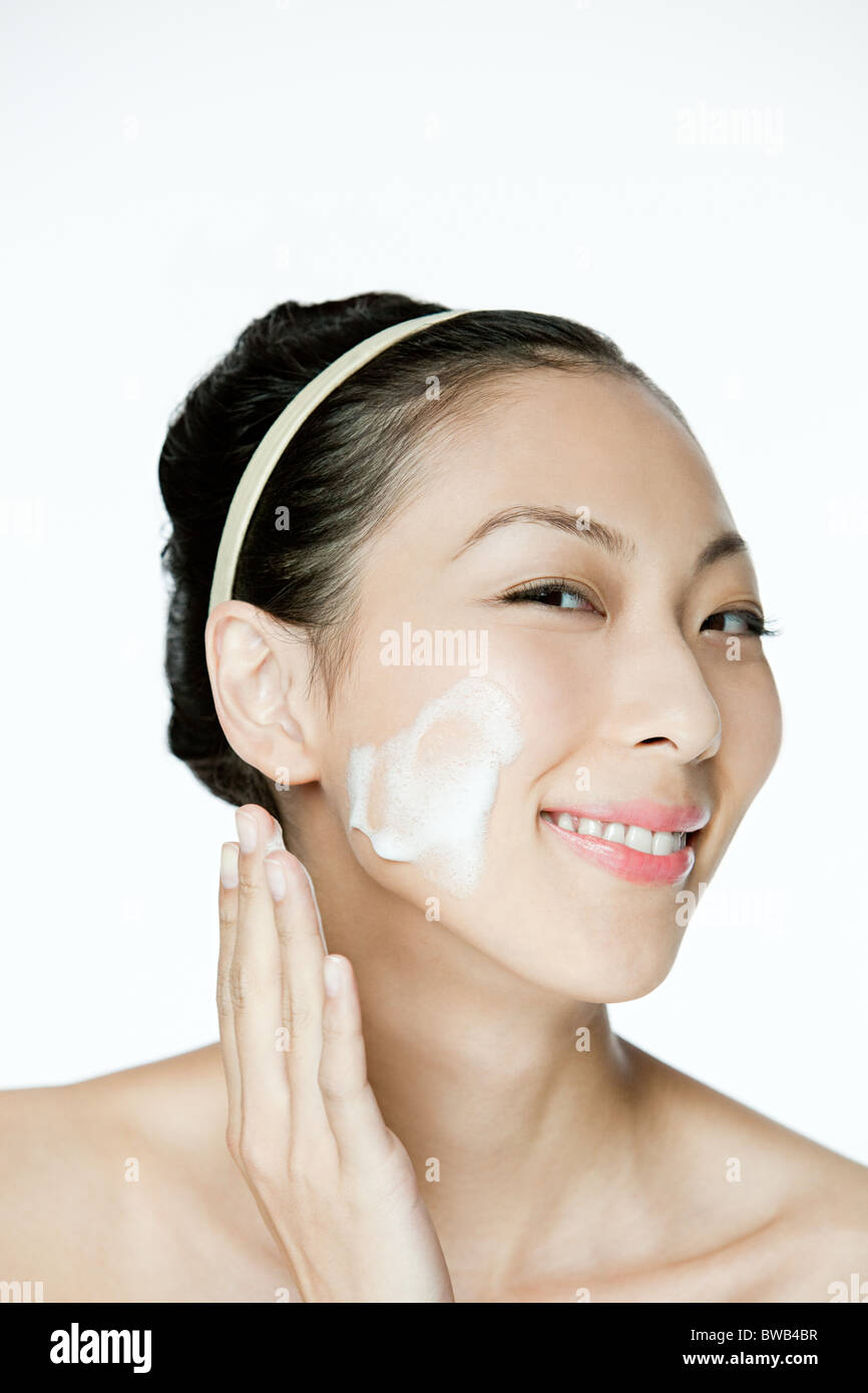 Woman washing face smiling camera hi-res stock photography and images ...
