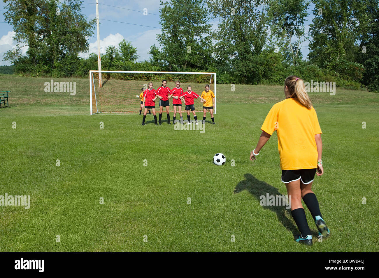 Girls soccer kick hi-res stock photography and images - Alamy