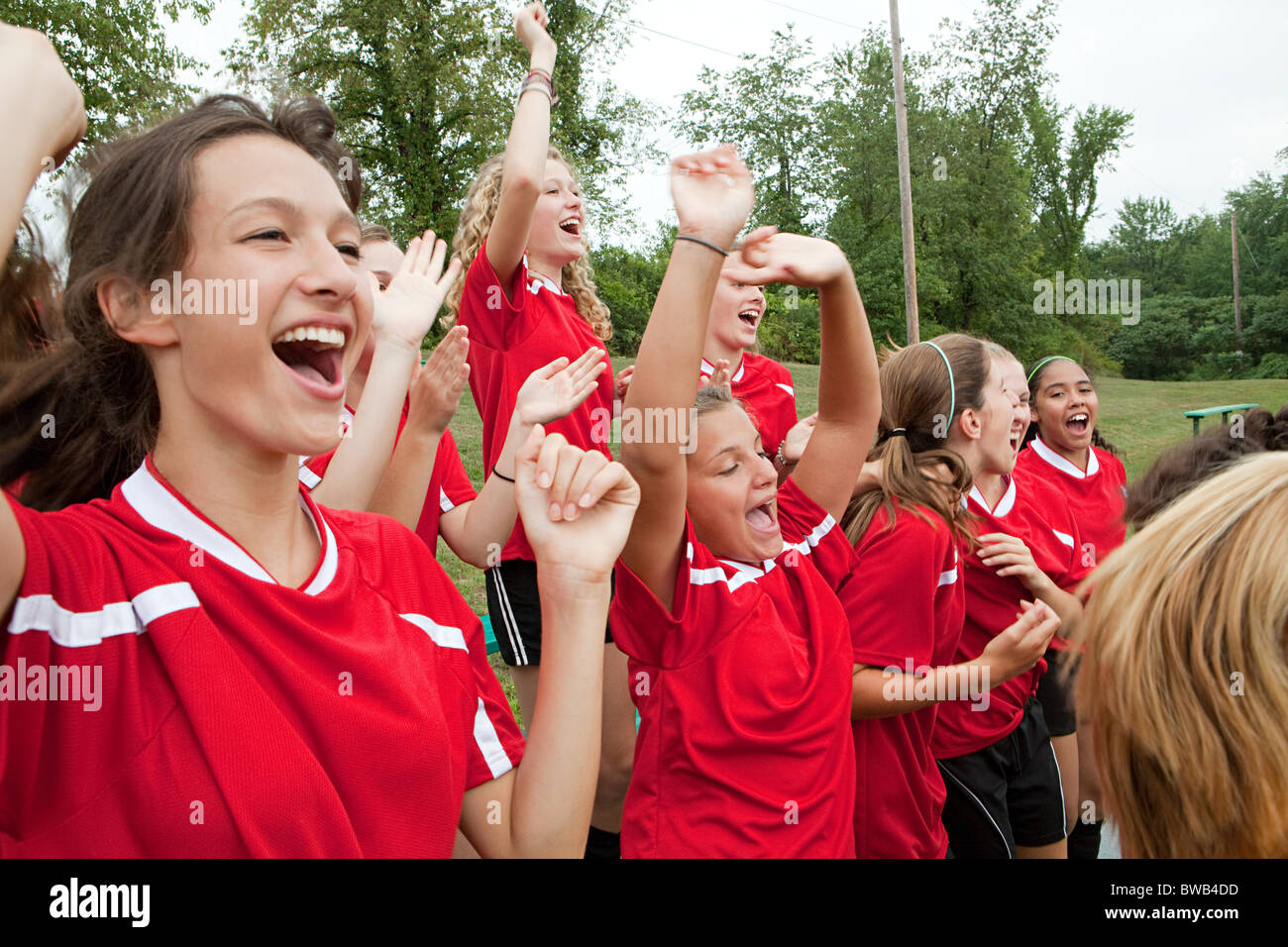 Female soccer players cheering Stock Photo - Alamy