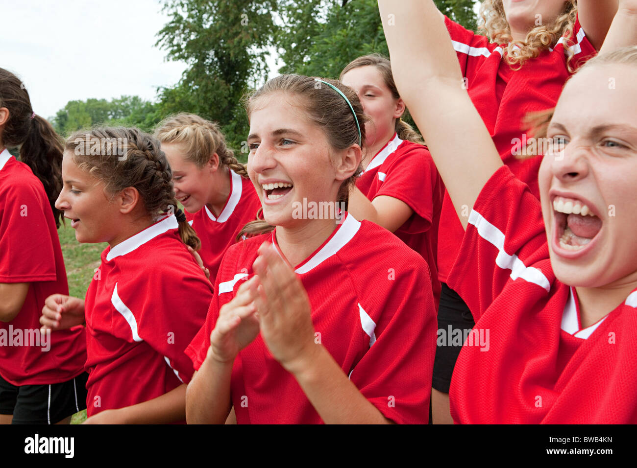 Female soccer players cheering Stock Photo - Alamy