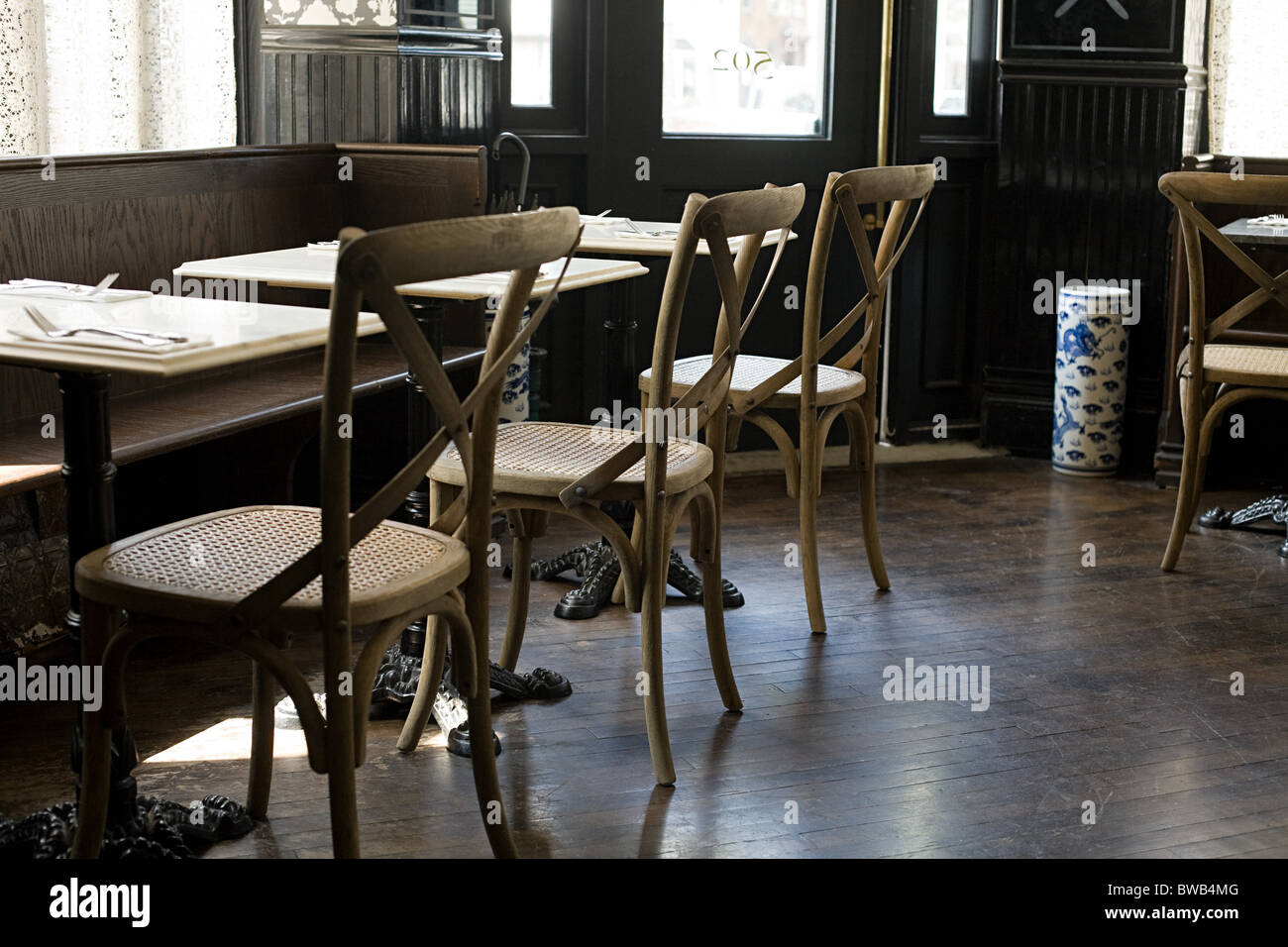 Chairs and tables in empty cafe Stock Photo - Alamy