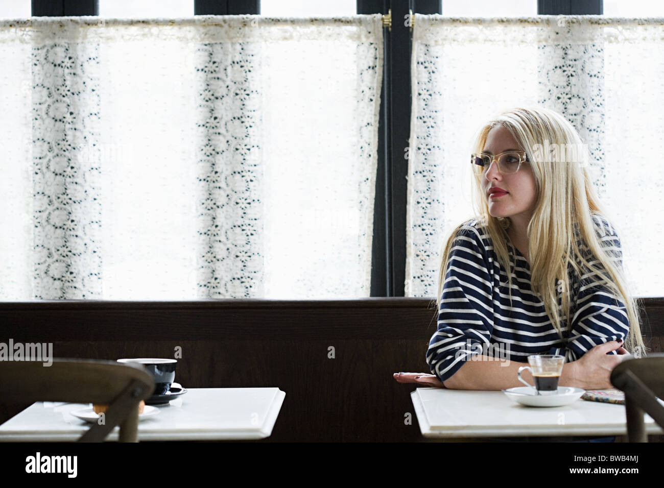 Woman waiting in coffee shop Stock Photo - Alamy